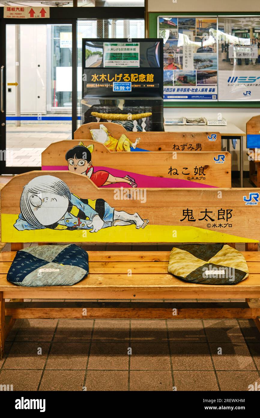 June 2023, Sakaiminato. Wooden benches decorated with pictures of ...