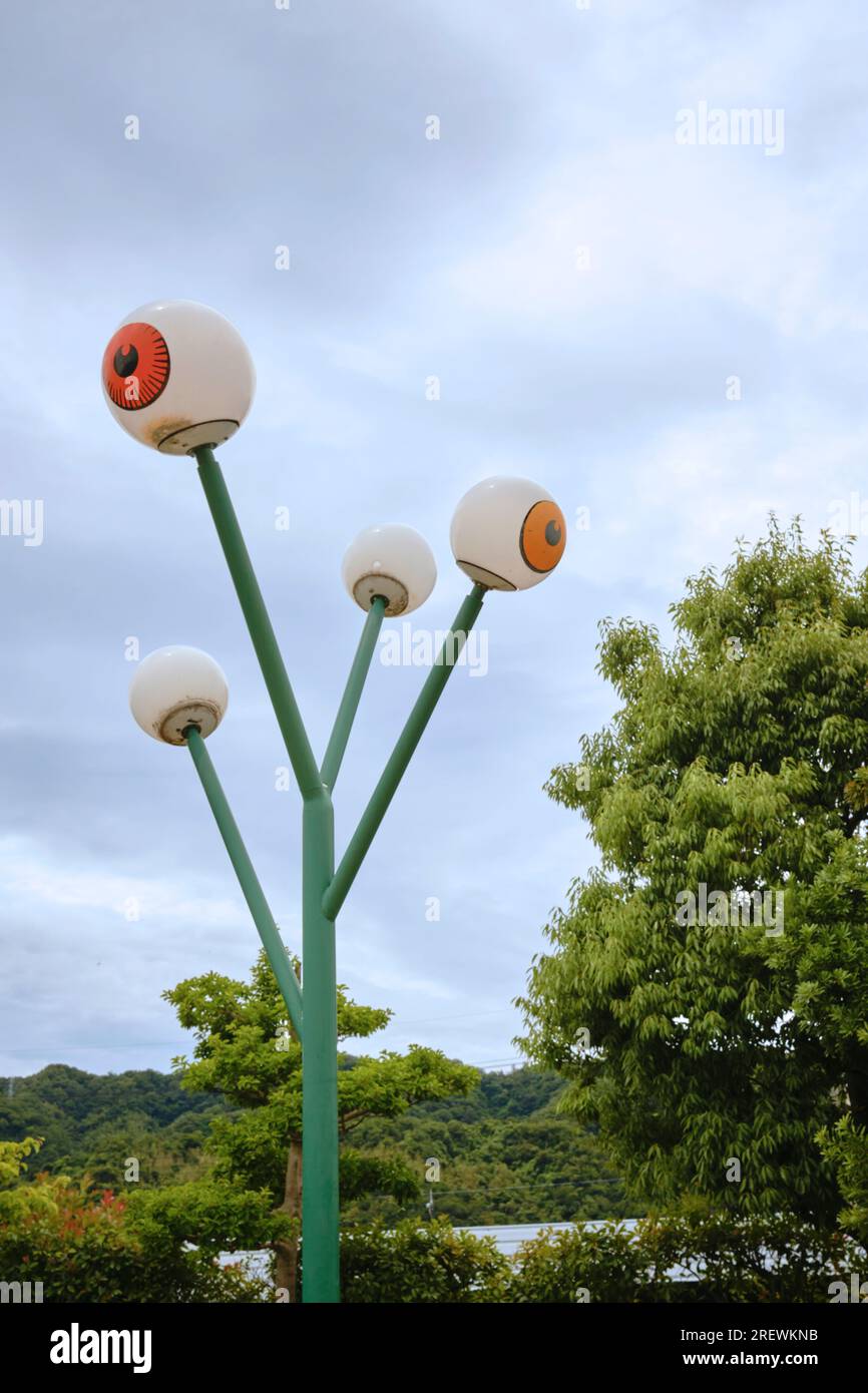 June 2023, Sakaiminato. Street light decorated with eyeballs, a yokai ...