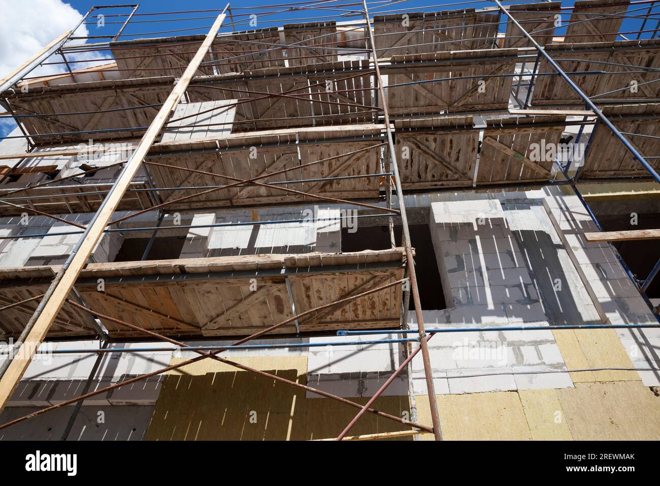 building a new home on the building scaffolding for construction and ...