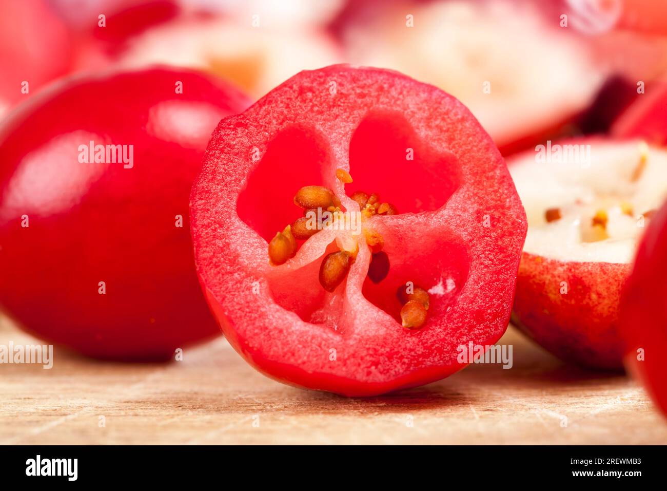 pulp and seeds of mature sour cranberries, cranberry berries divided ...