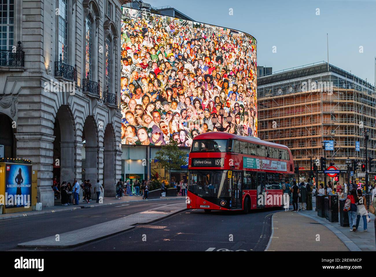 Faces light up the Piccadilly Circus giant billboard in London Stock ...