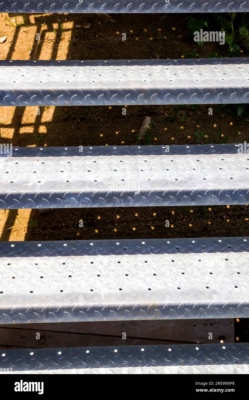 steel metal ladder made of strong metal and has an uneven structure of ...