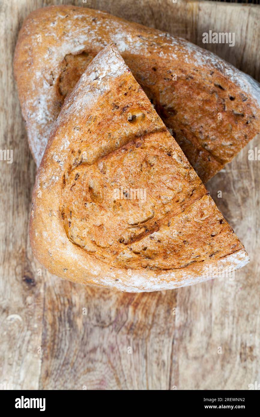 a loaf of dark bread made from several types of flour, a loaf of bread ...