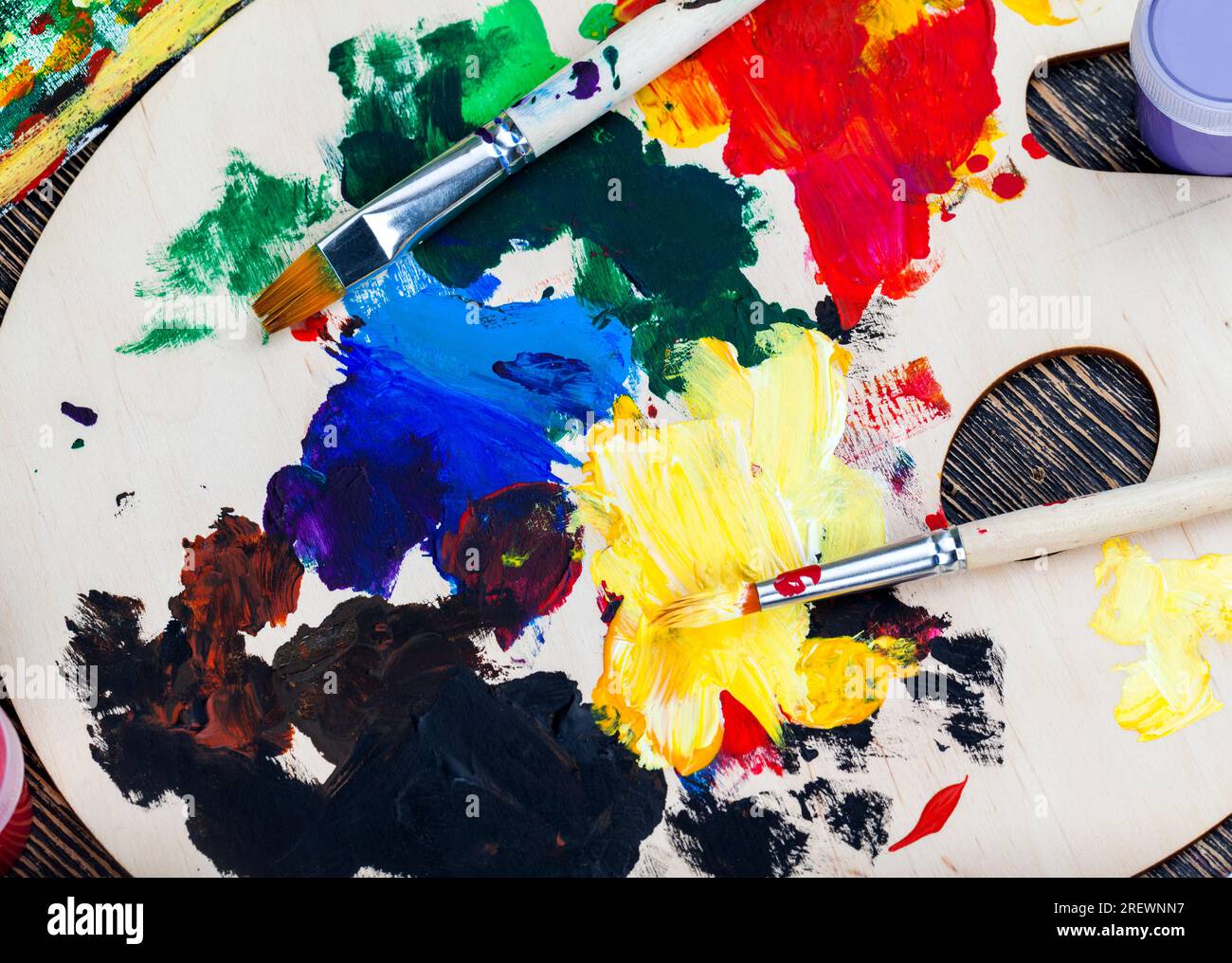 mixed together multi colored paints for creativity and drawing, oil and ...