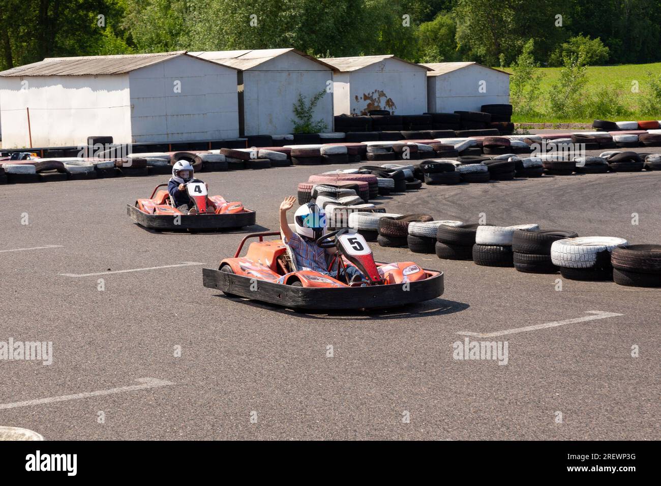 Youth Go Kart Racer on track. Dynamic image of teenage boy, moving fast ...