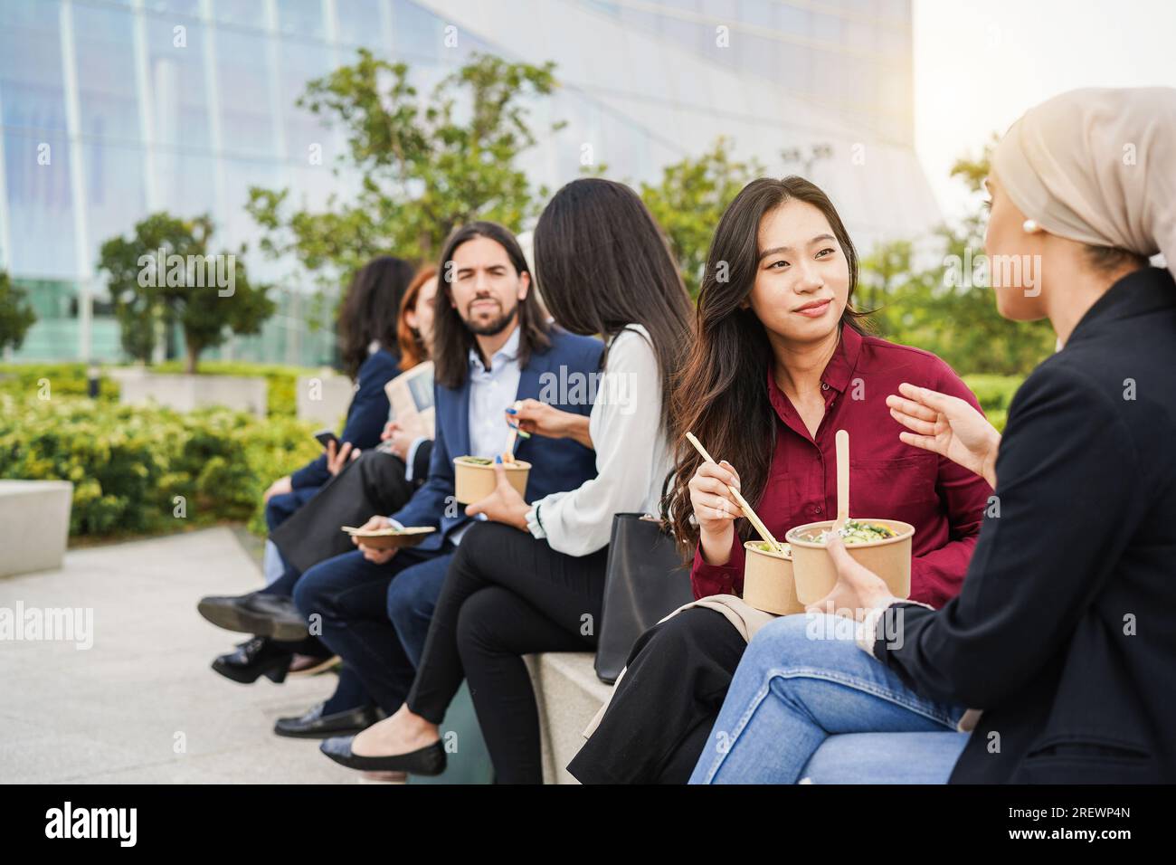 Business people doing lunch break with healthy fast food outdoor from ...