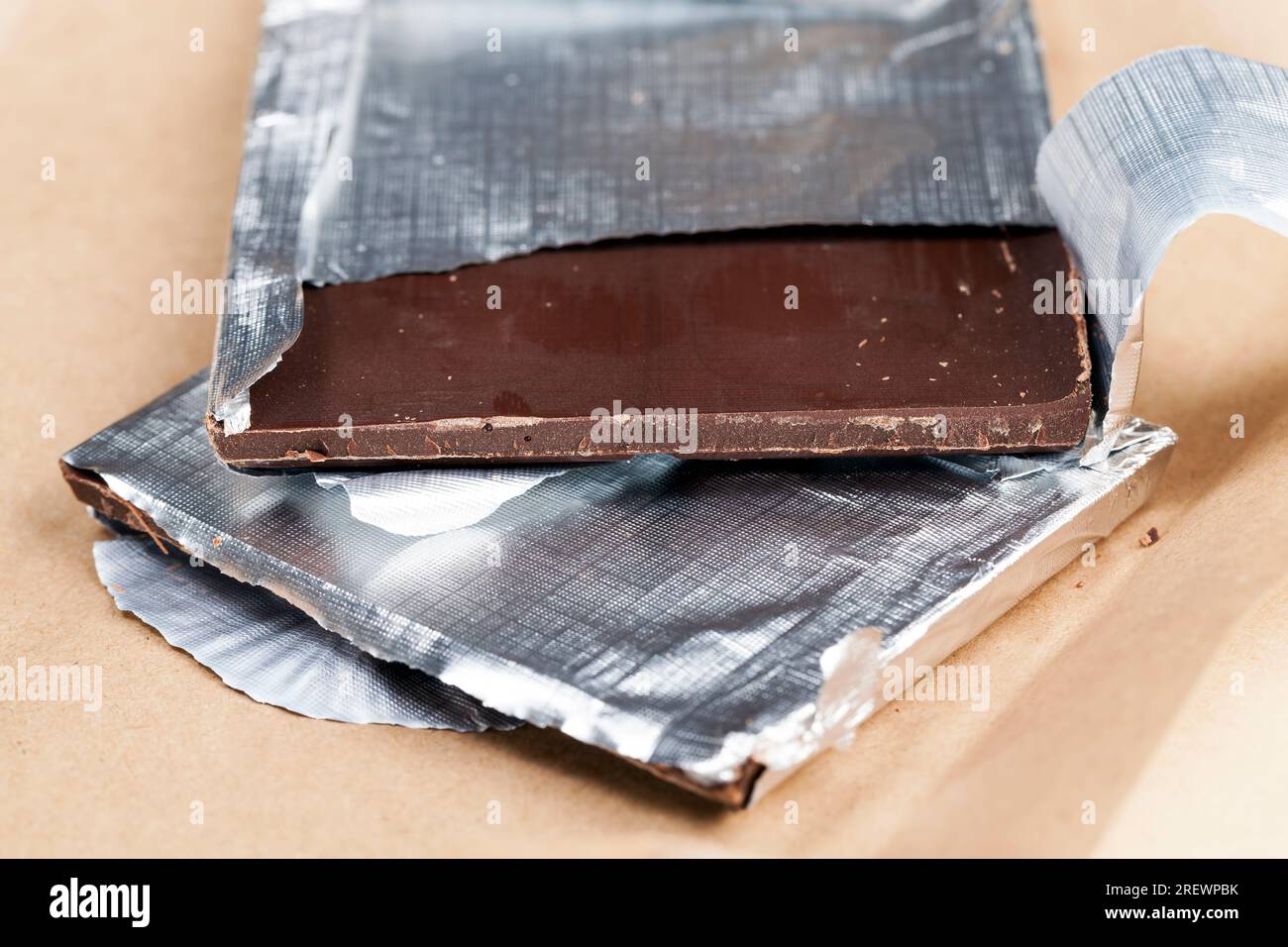 a broken milk chocolate bar made from cocoa and milk powder is a real ...