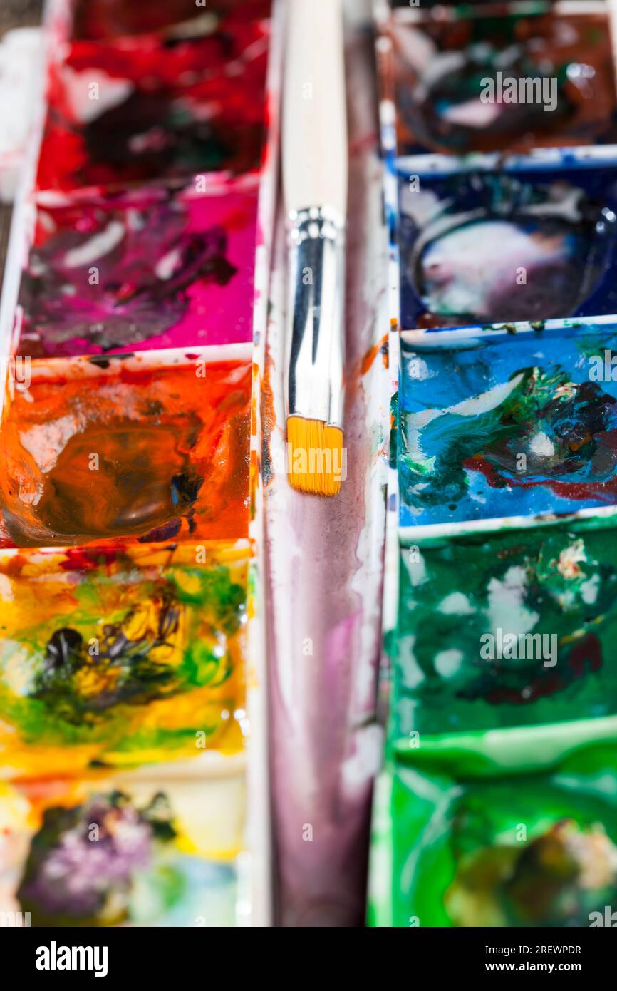 a person's creative process of drawing by mixing different colors of ...