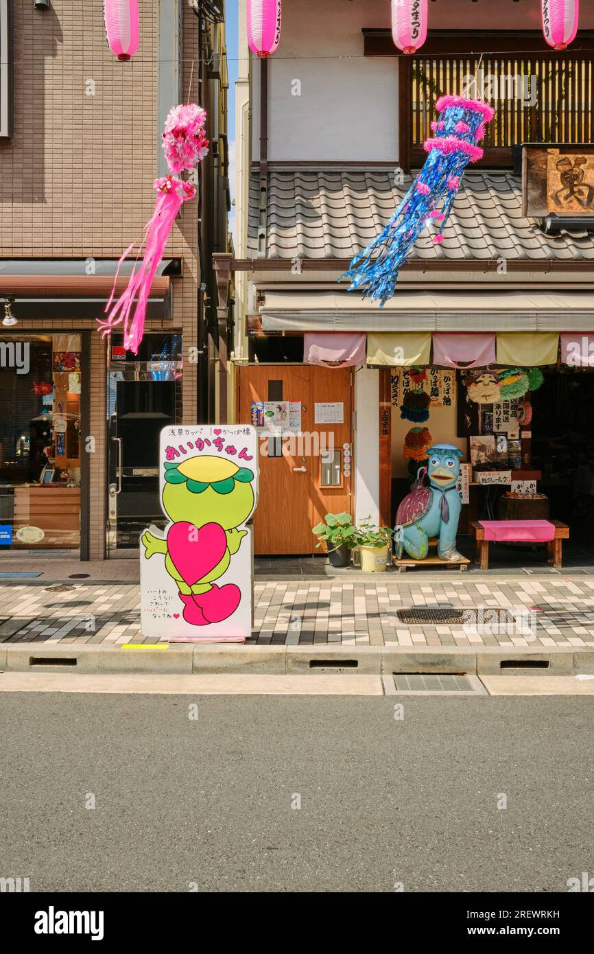 July 2023, Tokyo. Kappa (Japanese reptile yokai) sign and statue ...
