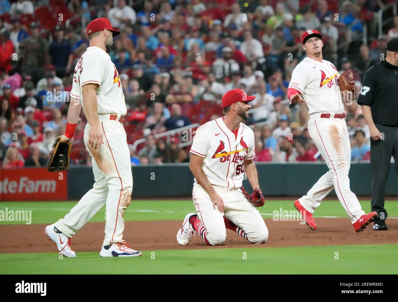 St. Louis Cardinals Adam Wainwright laughs as first baseman Paul ...