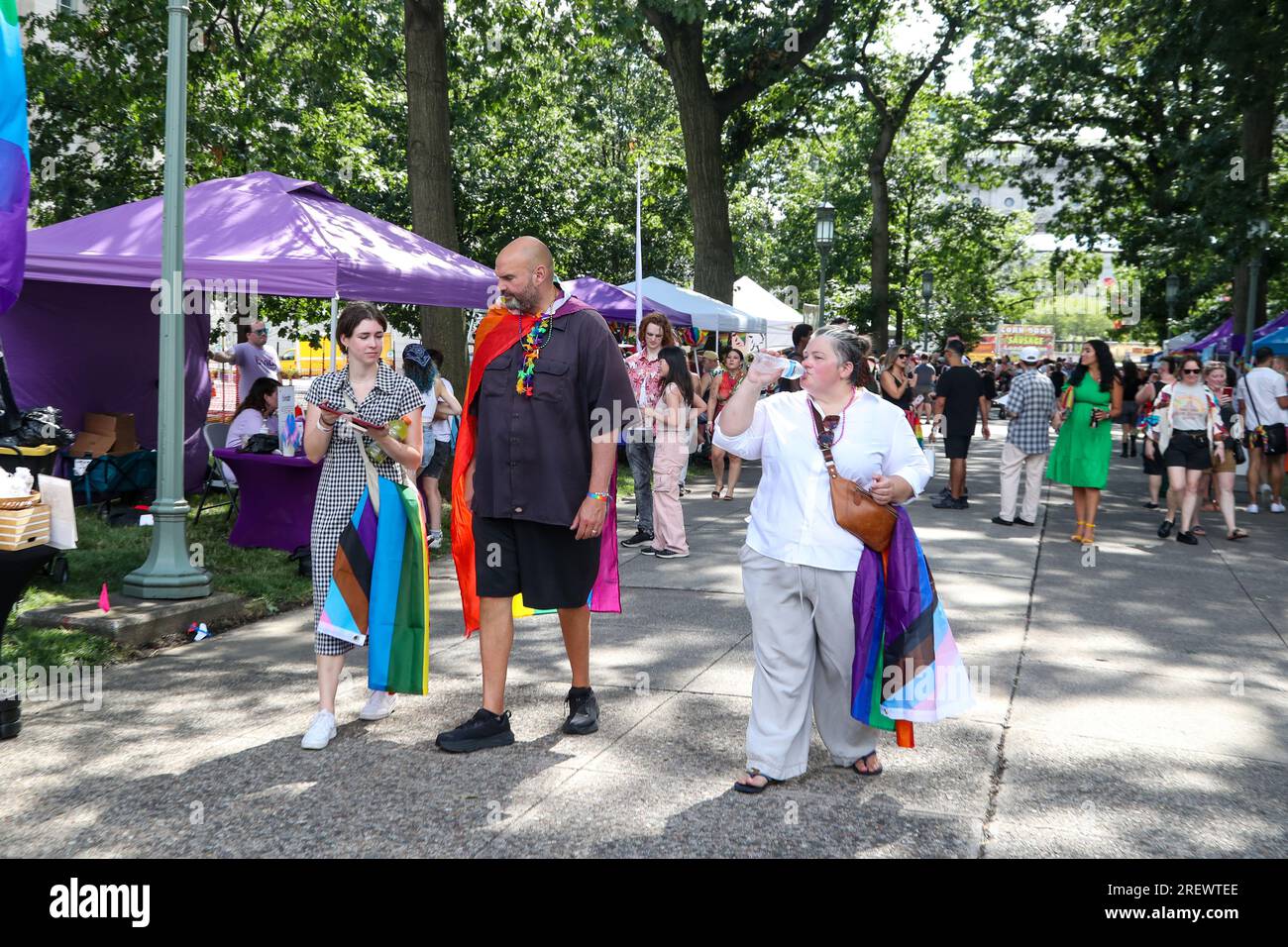 United States Senator John Fetterman (second from left) walks though ...