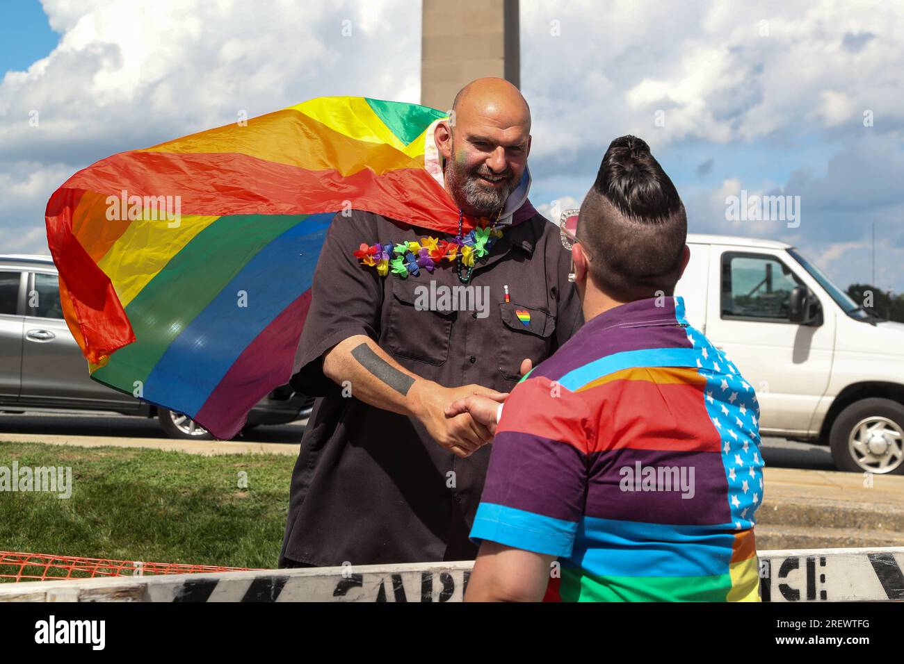 United States Senator John Fetterman (L) shakes the hand of drag ...