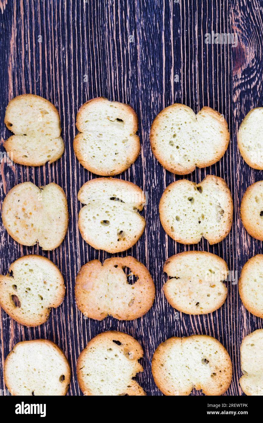 fried rye crackers with spices, closeup of food made from wheat flour ...