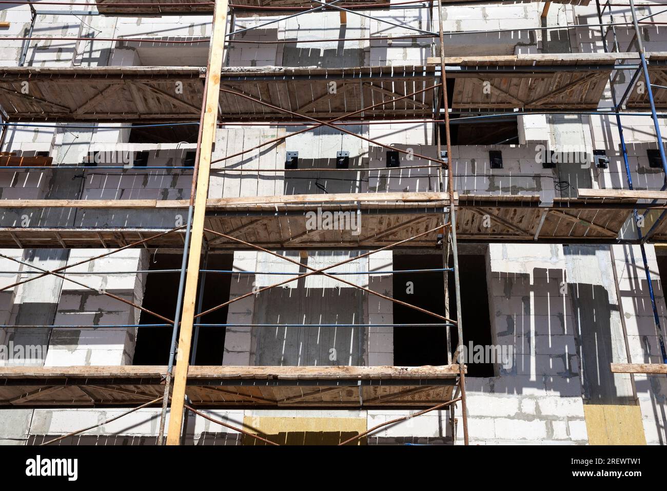 building a new home on the building scaffolding for construction and ...