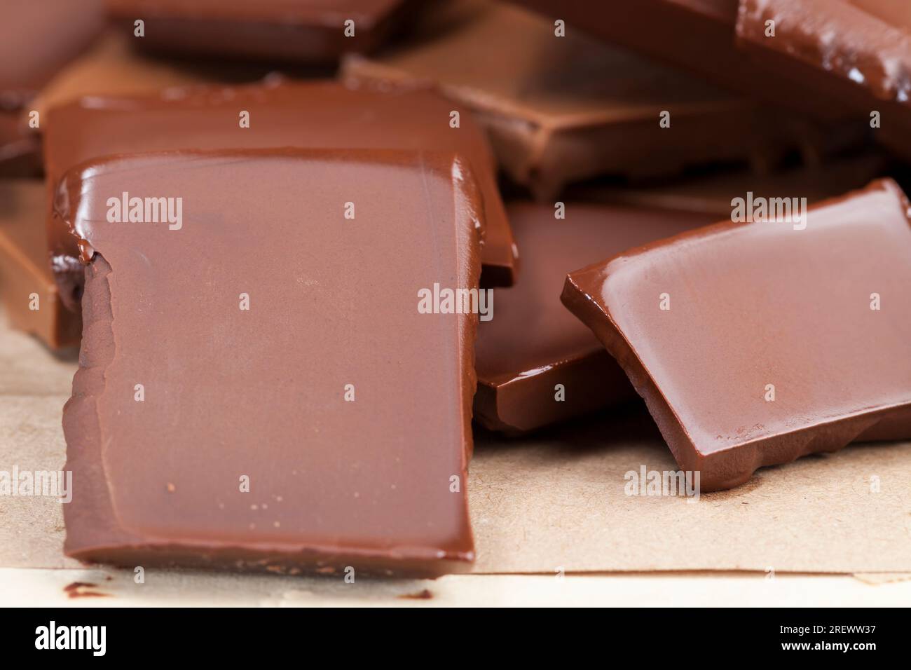 milk and bitter chocolate together are broken into pieces with a melted ...