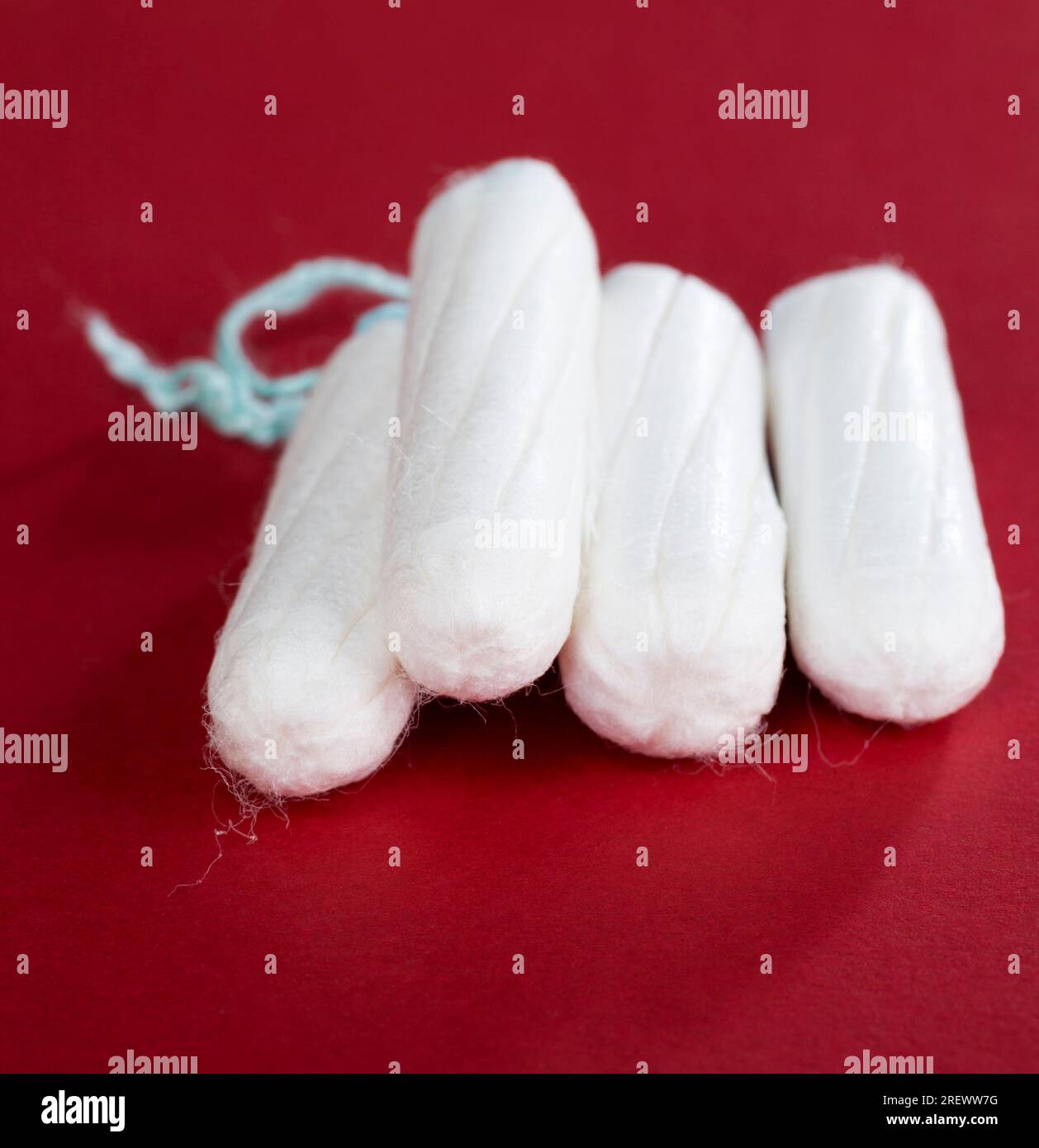 women's sanitary tampon on a red background, sanitary tampon made of ...