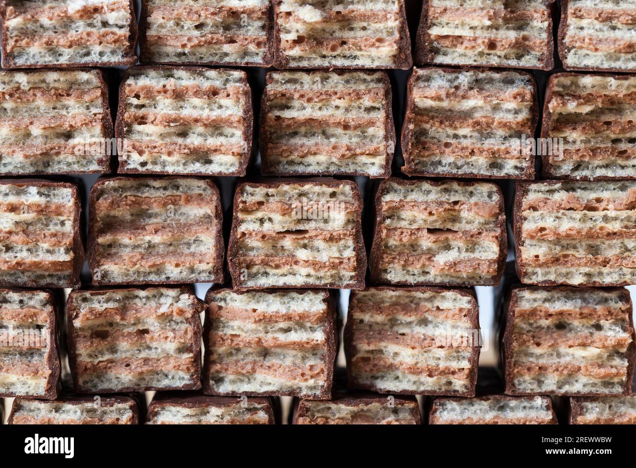 close up of chocolate candies and crispy flour waffles, milk chocolate ...