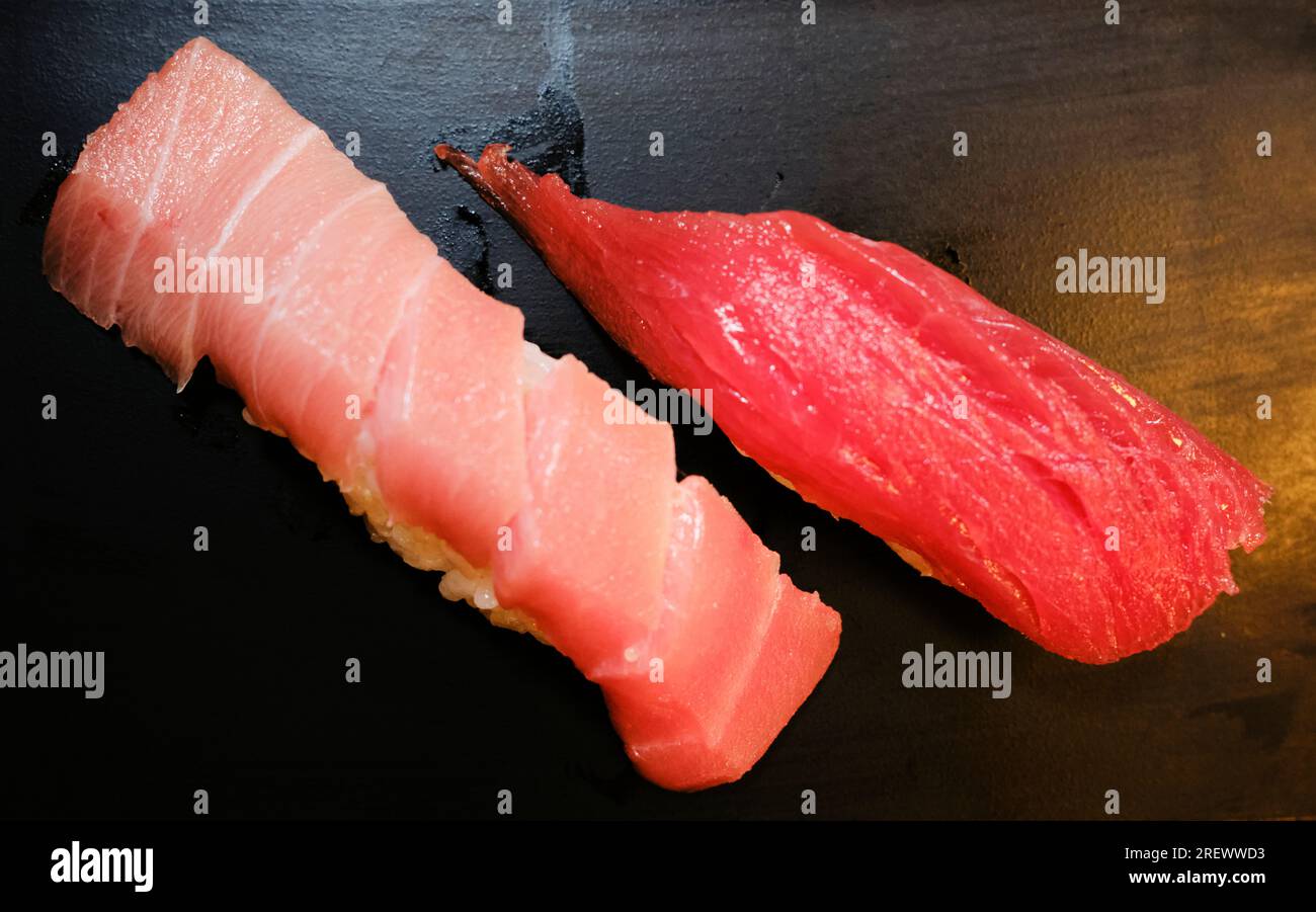 July 2023, A plate of two nigiri sushi. On the left is a piece of fatty ...