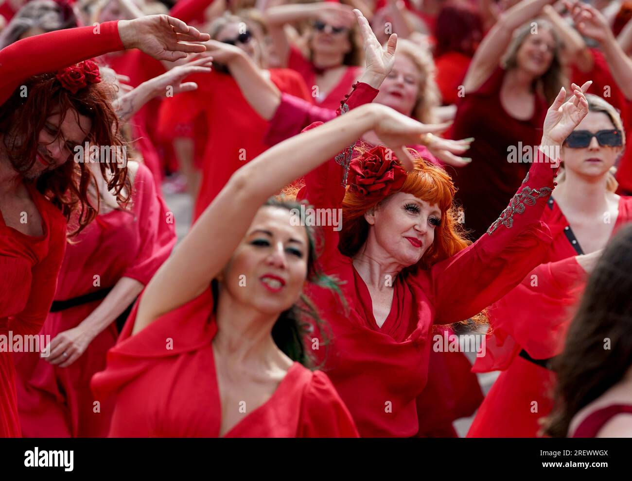 People dressed in red take part in a mass dance event to Kate Bush's ...