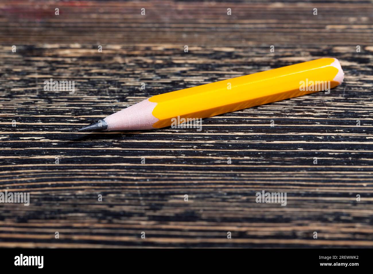 ordinary yellow wooden pencil with gray soft lead for drawing and ...