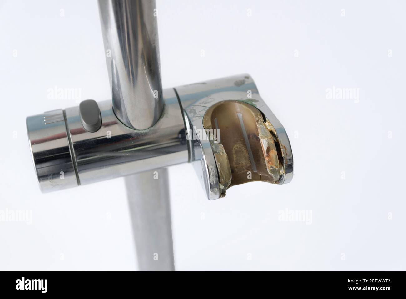 Close up of a worn out rubber for the shower holders. On a white ...