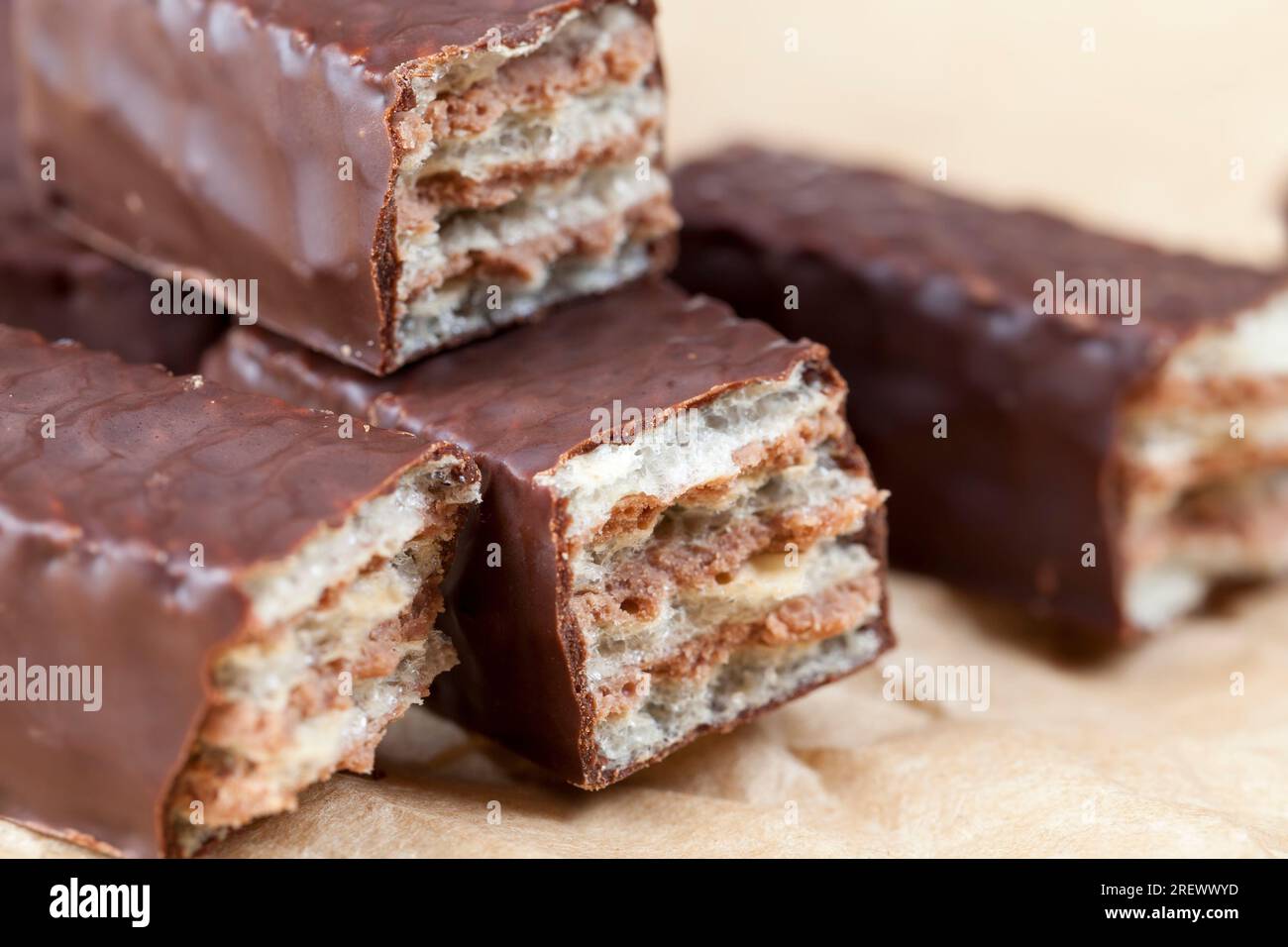 milk chocolate candies close up, cocoa candies with waffles, chocolate ...