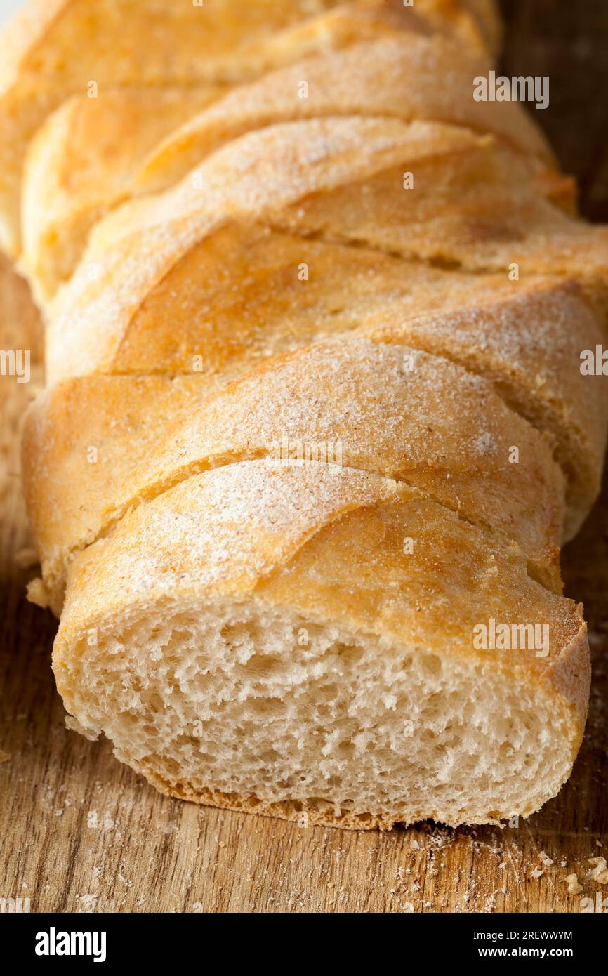 cut white bread into pieces to use for sandwiches Stock Photo - Alamy