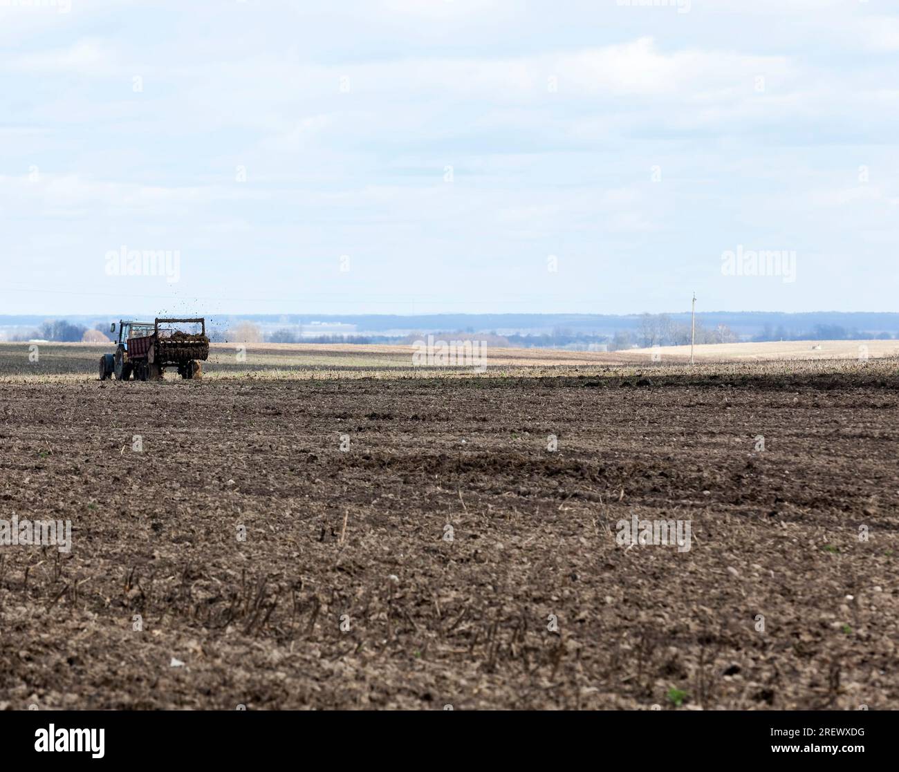 plowed agricultural field and fertile soil that is fertilized with ...