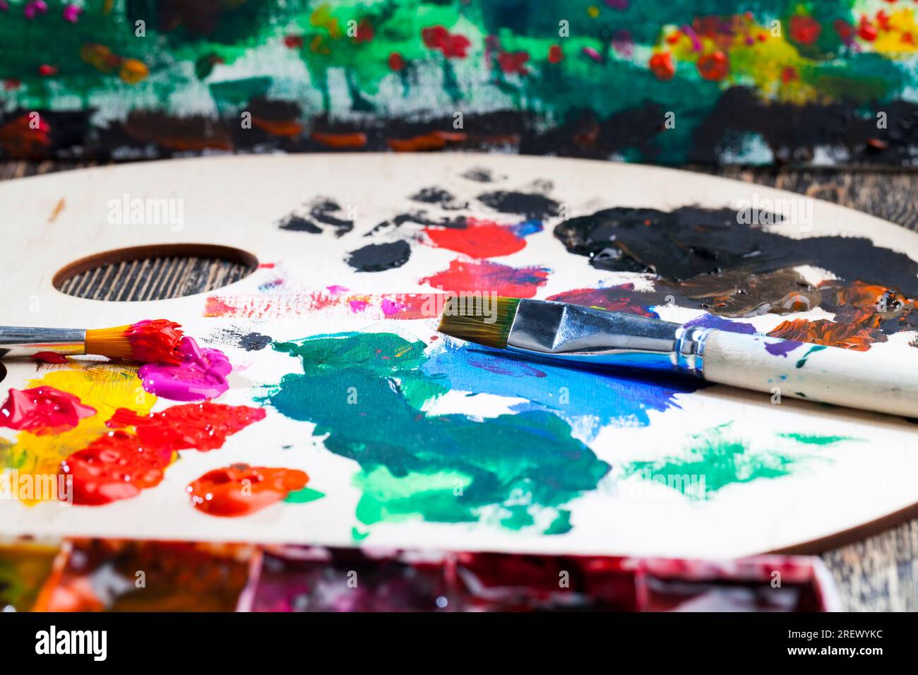 paints and art brushes for drawing, multi colored paints close up, high ...