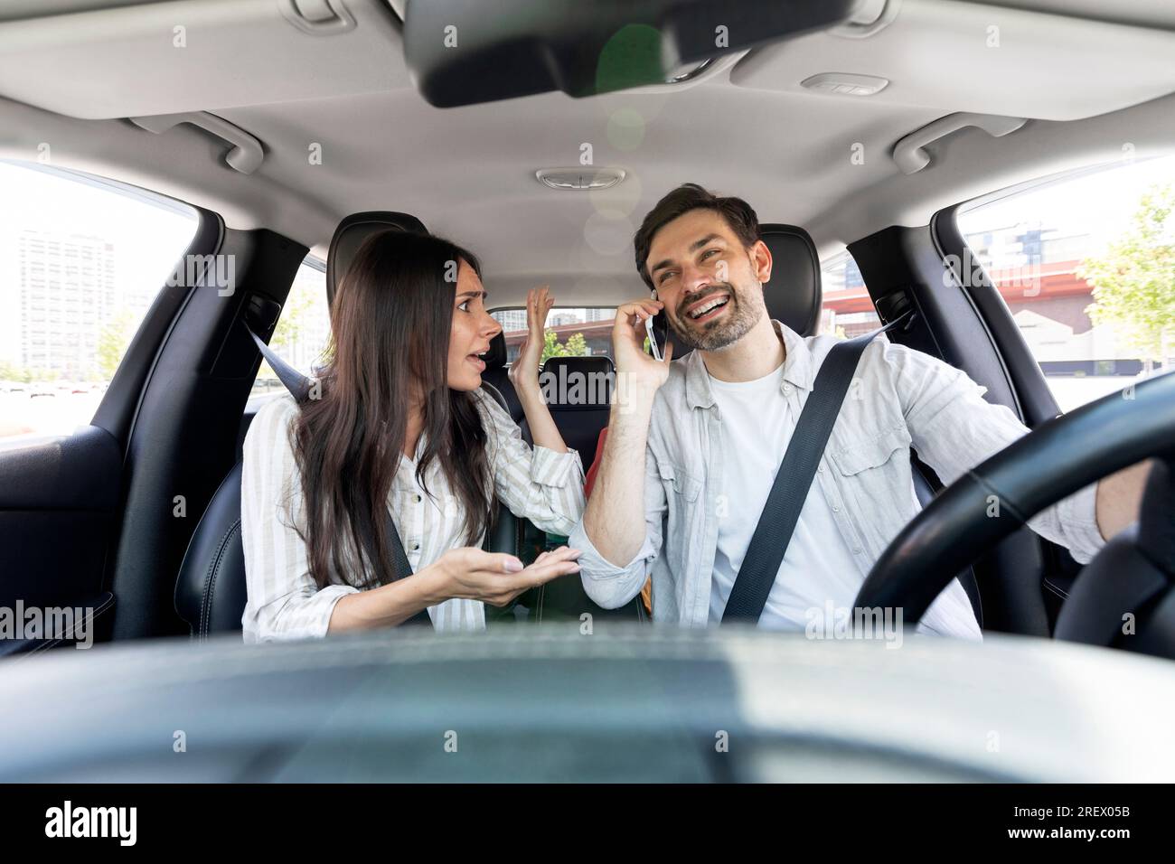 Angry woman shouting while the car driver talking on phone Stock Photo ...