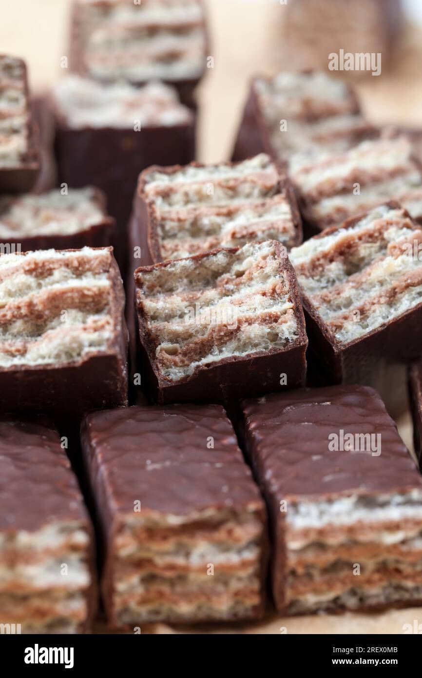 milk chocolate candies close up, cocoa candies with waffles, chocolate ...