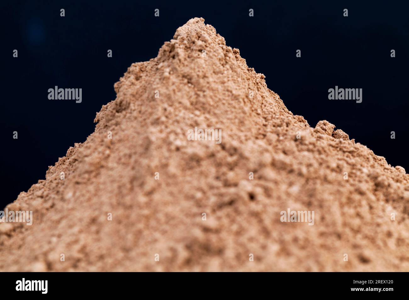 a large pile made from cocoa bean powder for making chocolate or other ...