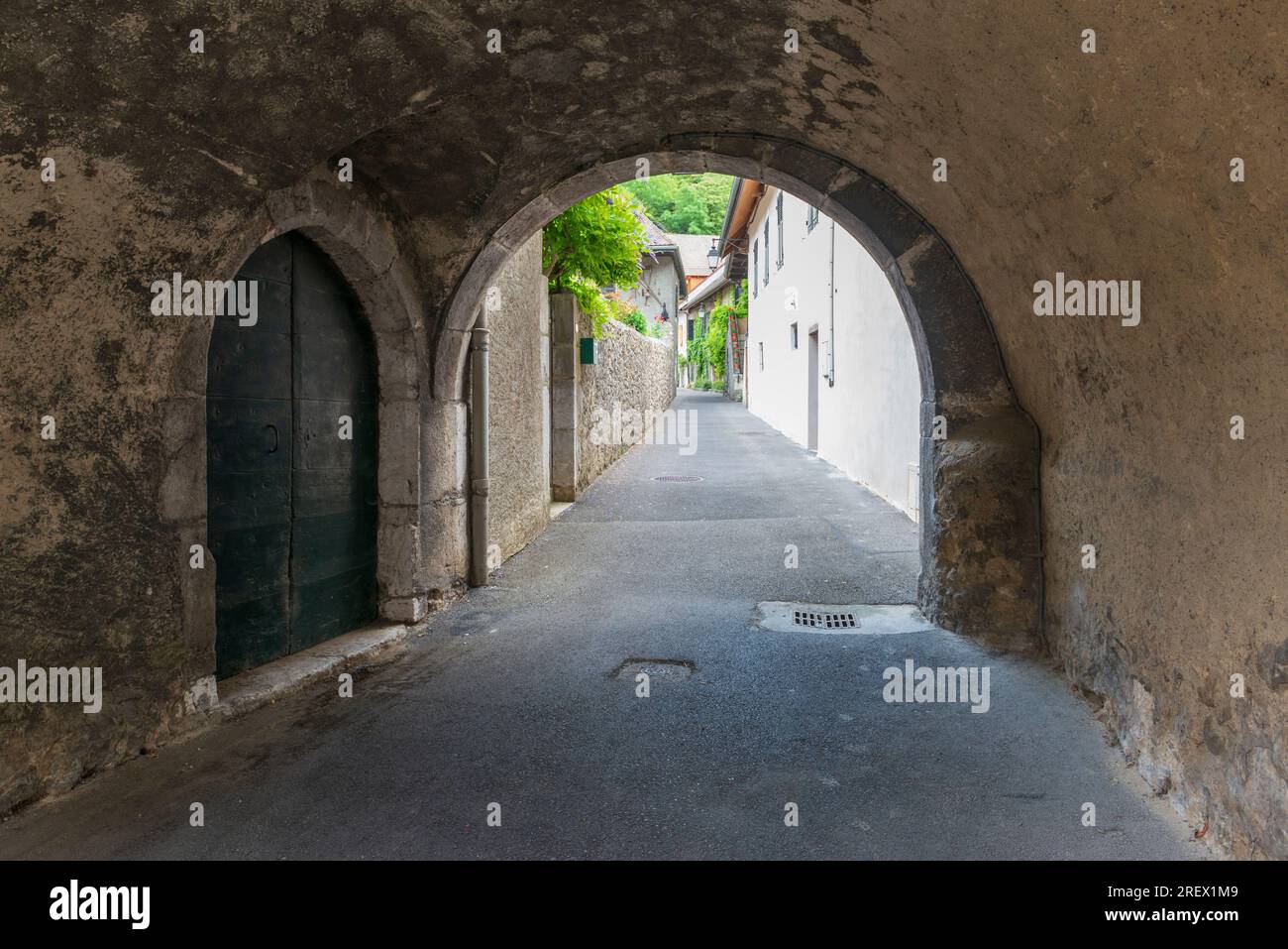 Narrow streets of old french town in Provence. Stone arch and walls ...