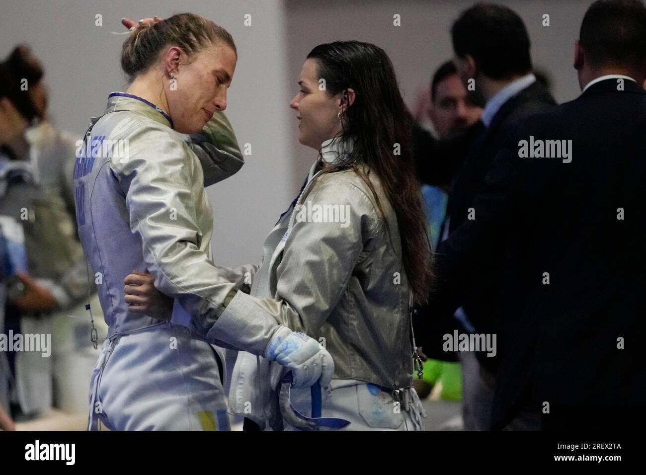 Ucraine's Olga Kharlan, left, cries after her team looses against Korea ...