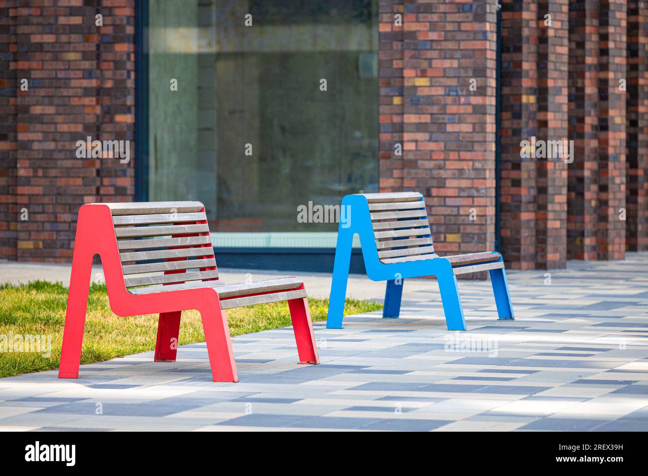 modern colored bench on the city street. resting place for citizens ...