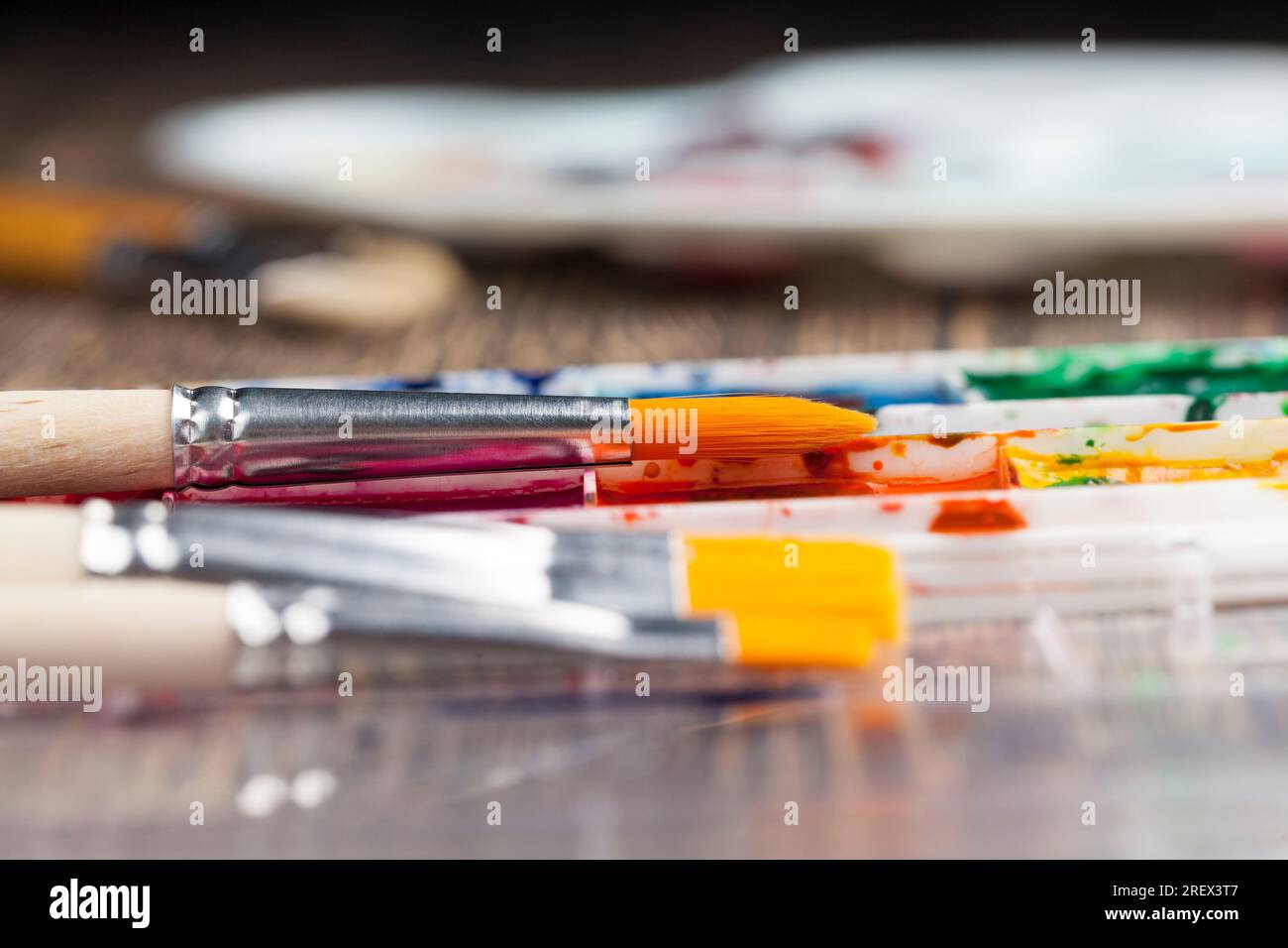 the creative process of drawing by mixing different colors of paints ...