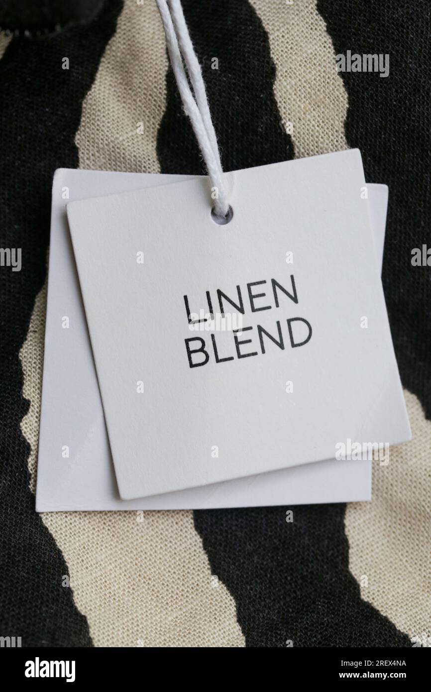 Close up of clothing hang tag. Linen blend product details Stock Photo ...