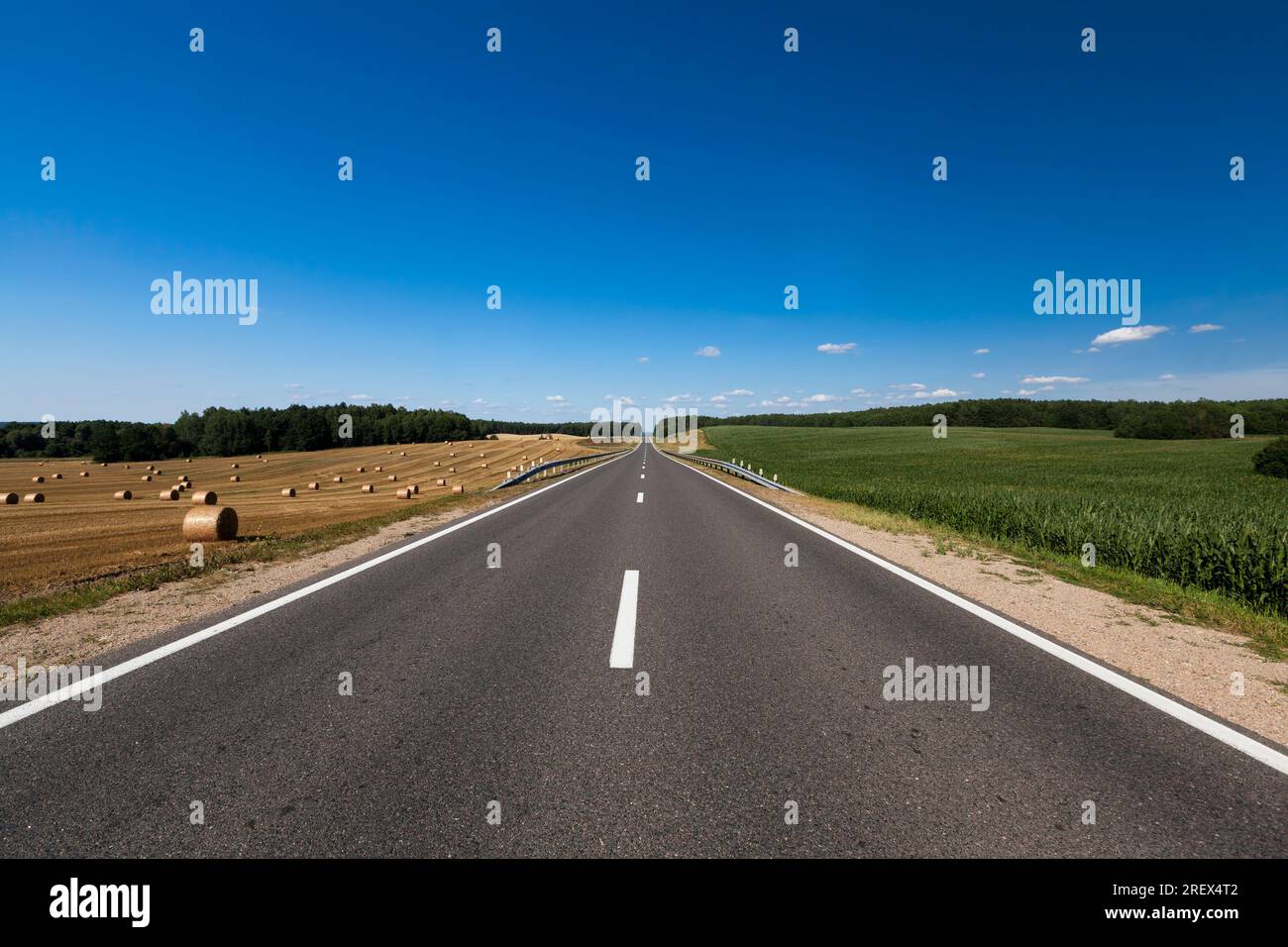 the highway is built through agricultural fields where food is grown ...