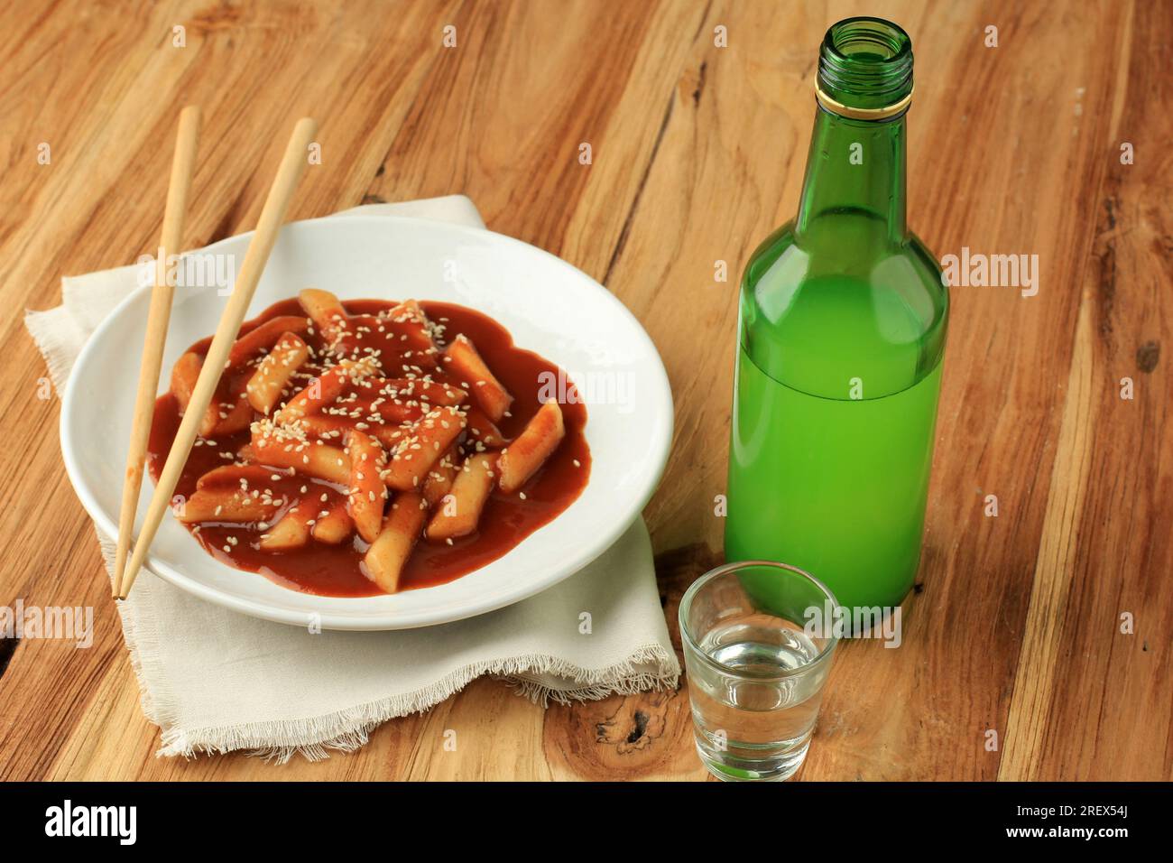 Tteokbokki Korean Rice Cake with Soju on Wooden Table Stock Photo - Alamy
