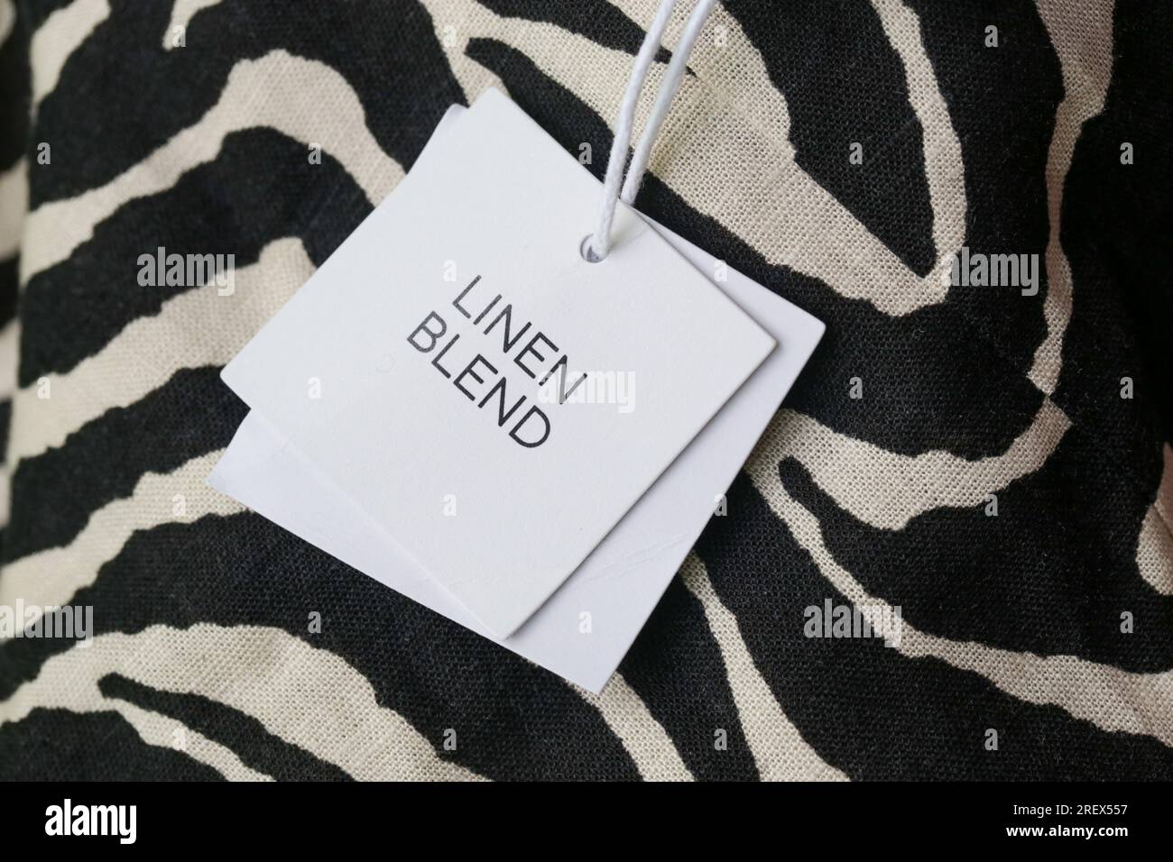 Close up of clothing hang tag. Linen blend product details Stock Photo ...
