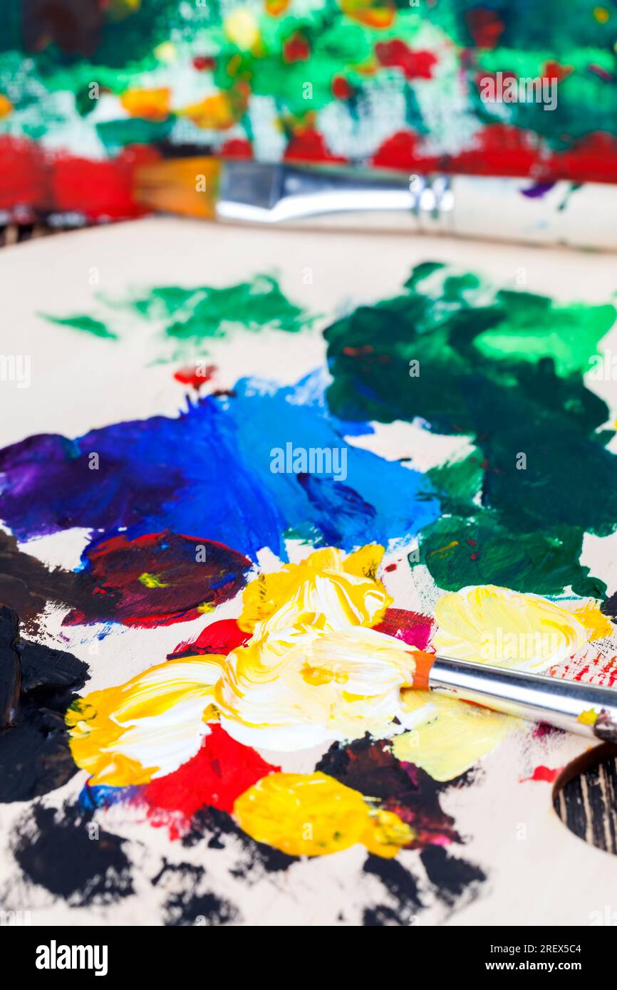 mixed together multi colored paints for creativity and drawing, oil and ...