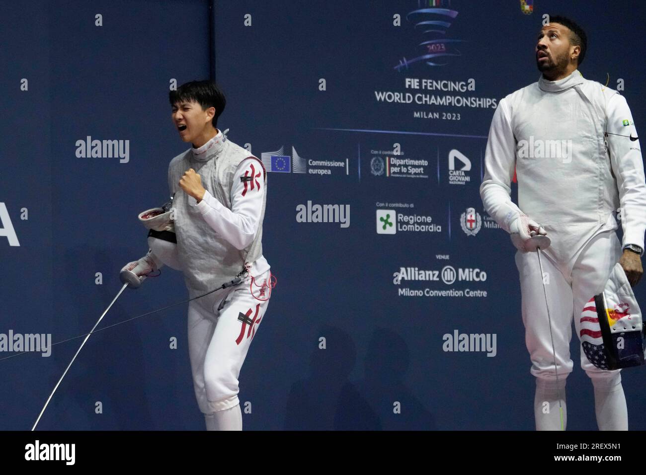 Hong Kong's Chi Ka Jeung, left, celebrates a point as he competes ...