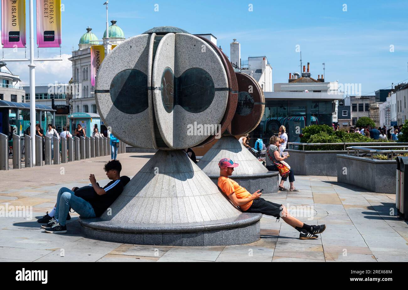 People sitting by public sculptures at Churchill Square Shopping Centre ...
