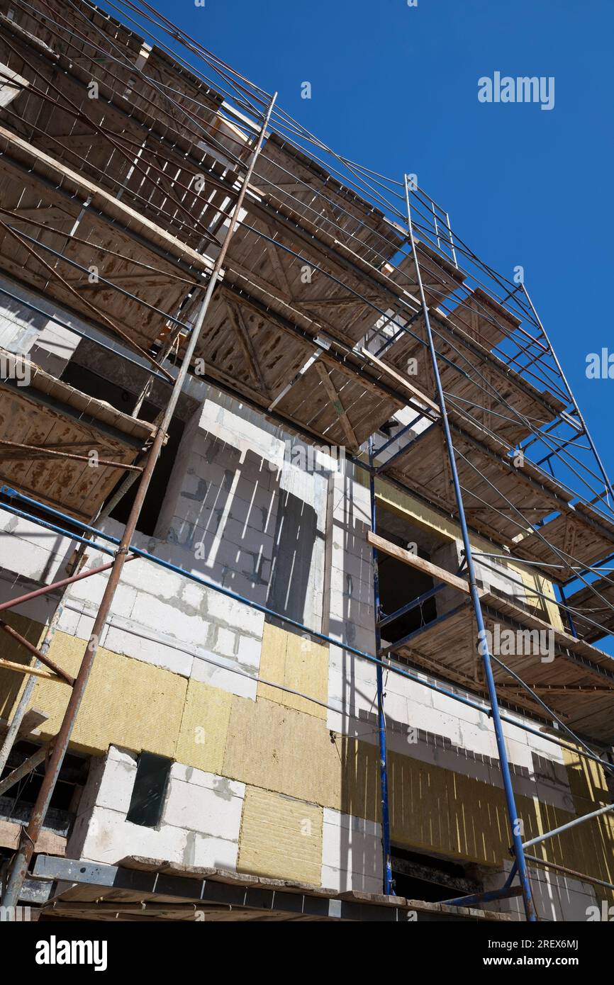 building a new home on the building scaffolding for construction and ...