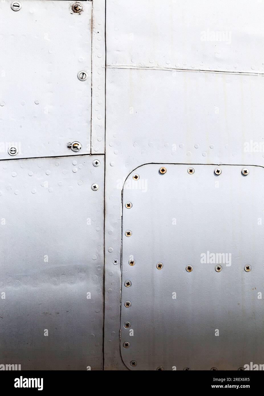 aluminum sheets joined together by welding and riveting, close up of ...