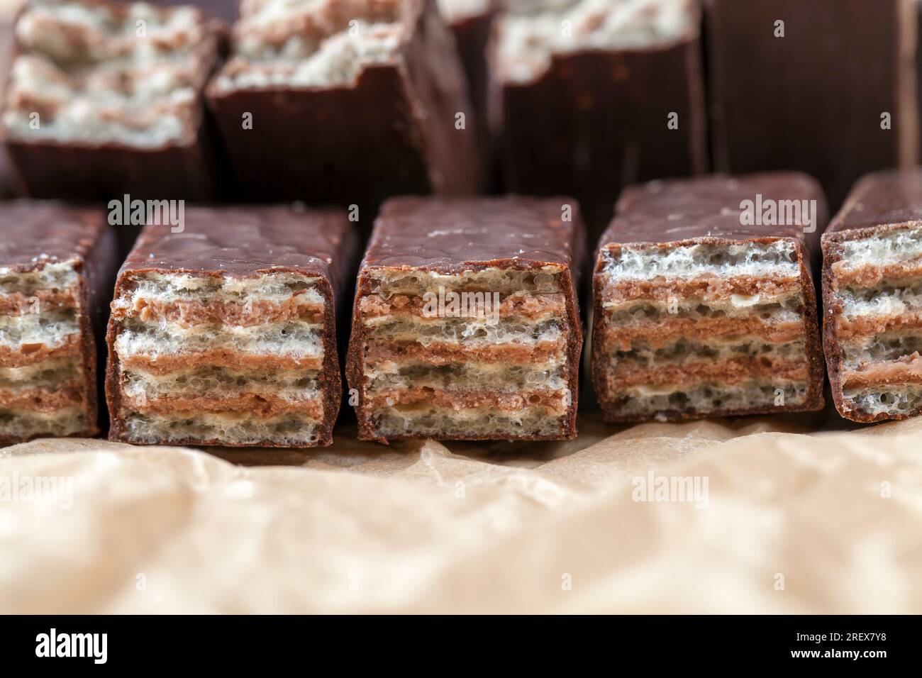 close up of chocolate candies and crispy flour waffles, milk chocolate ...