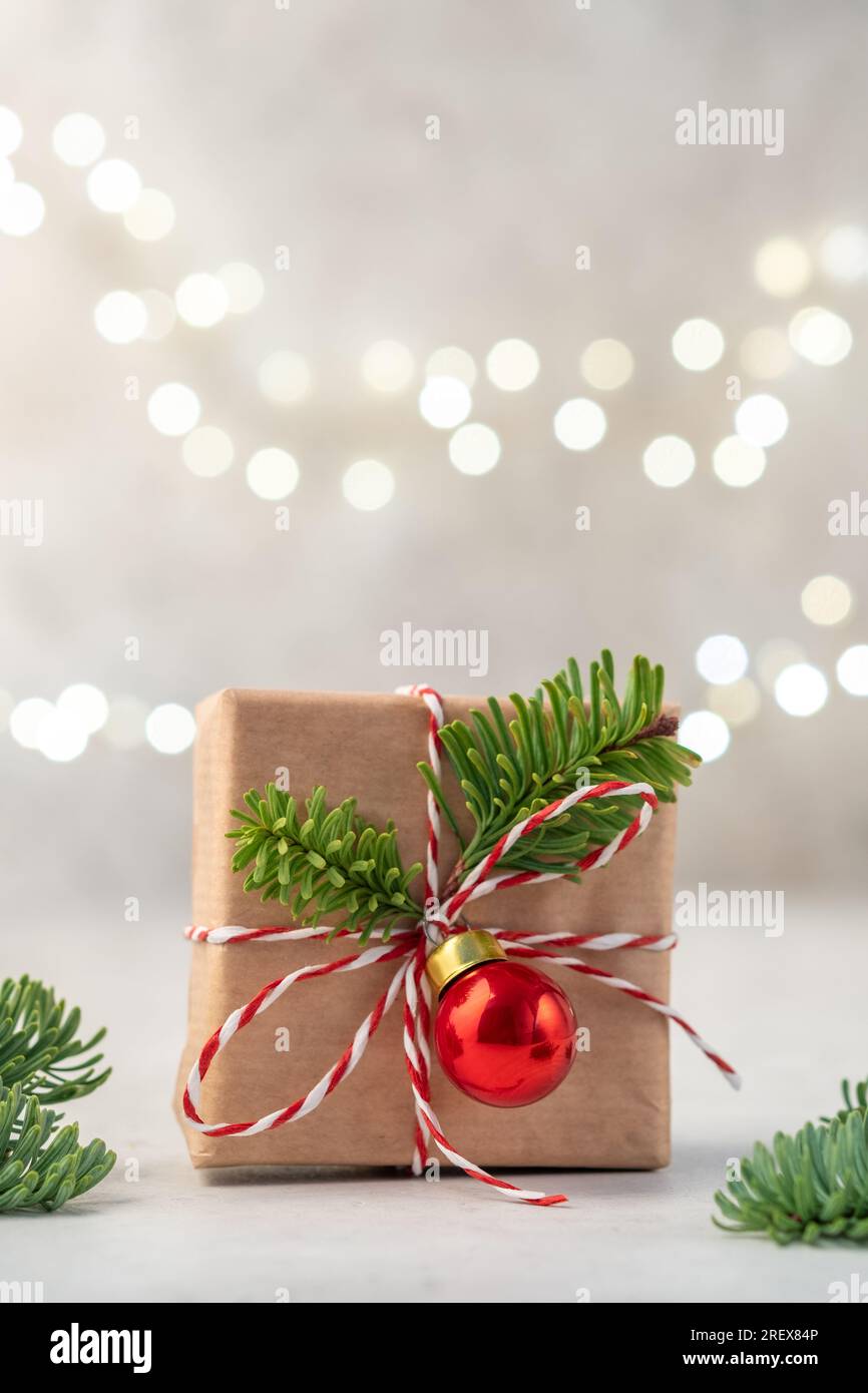 Christmas gift boxes. Craft paper and red ribbon Stock Photo - Alamy