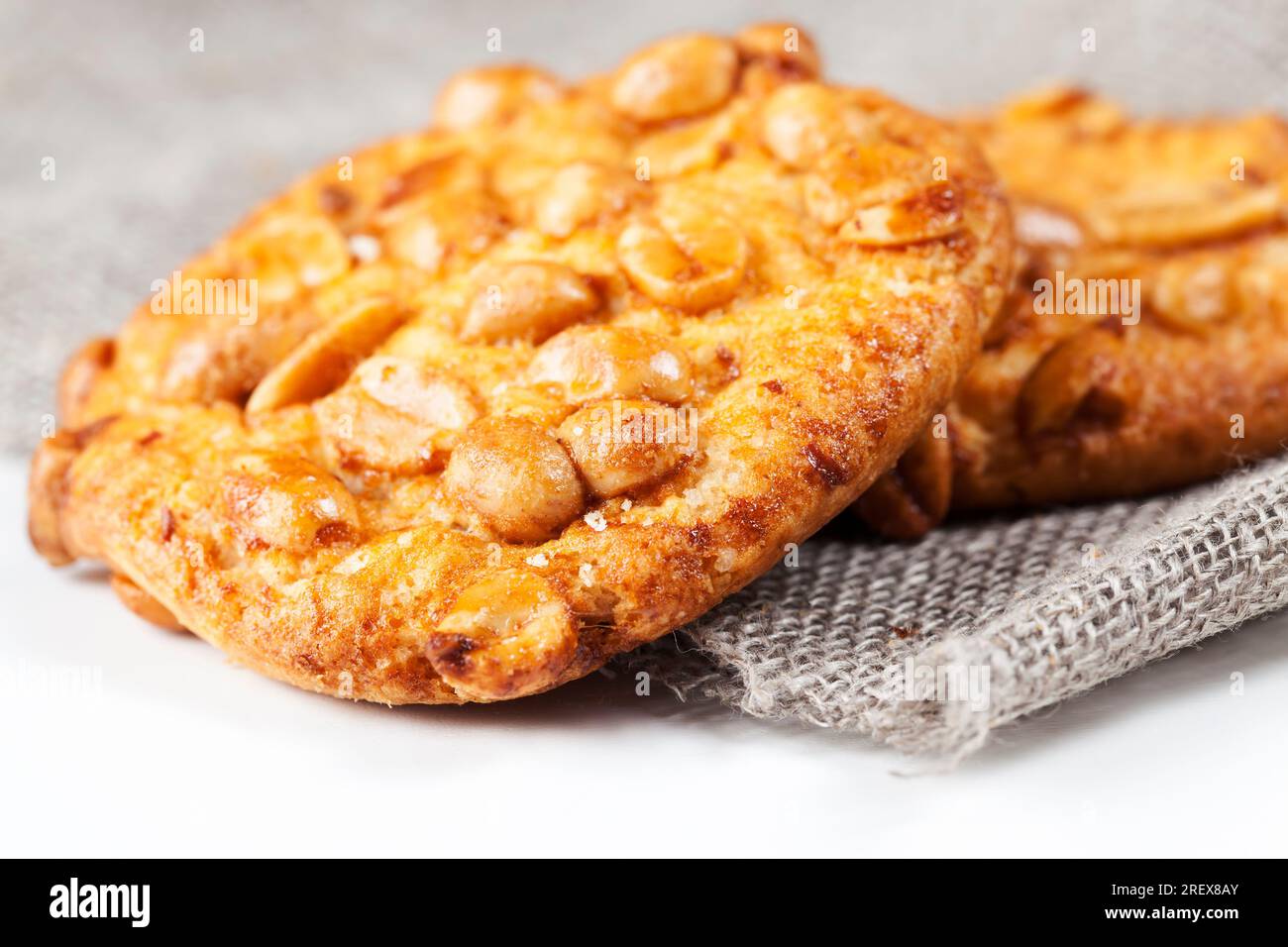 fresh crunchy cookies made from wheat flour and roasted peanuts, on the ...