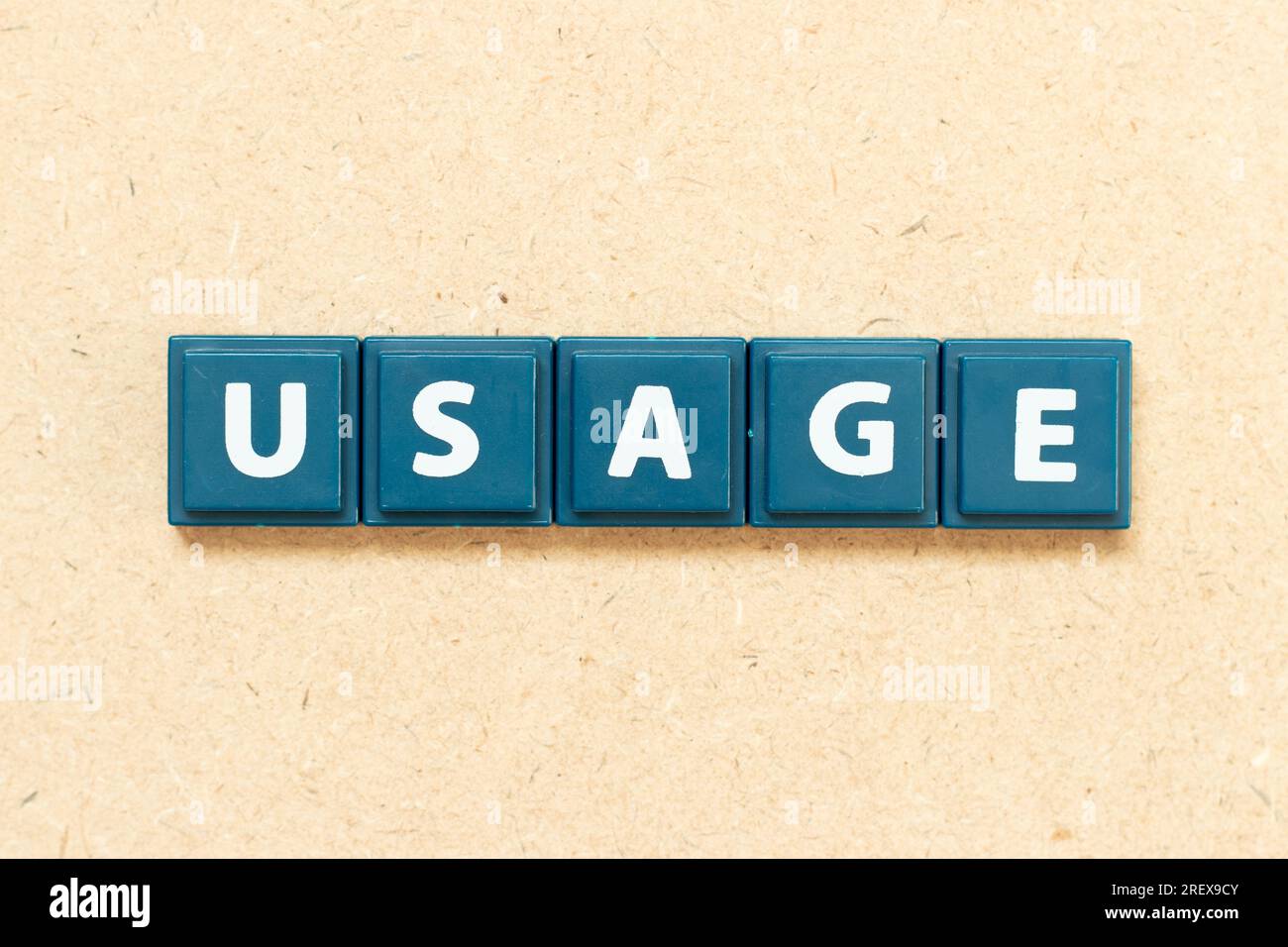 Tile alphabet letter in word usage on wood background Stock Photo - Alamy