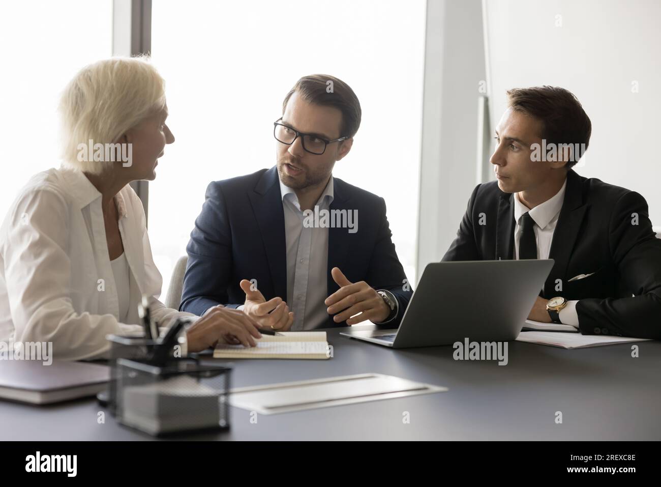 Business project leader discussing marketing strategy with employees ...